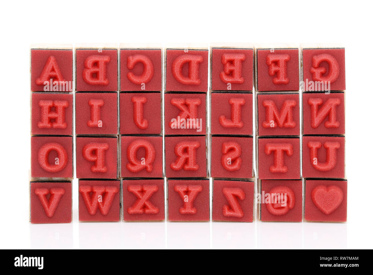 Close up of type set rubber stamps with wooden handle. the alphabet ...