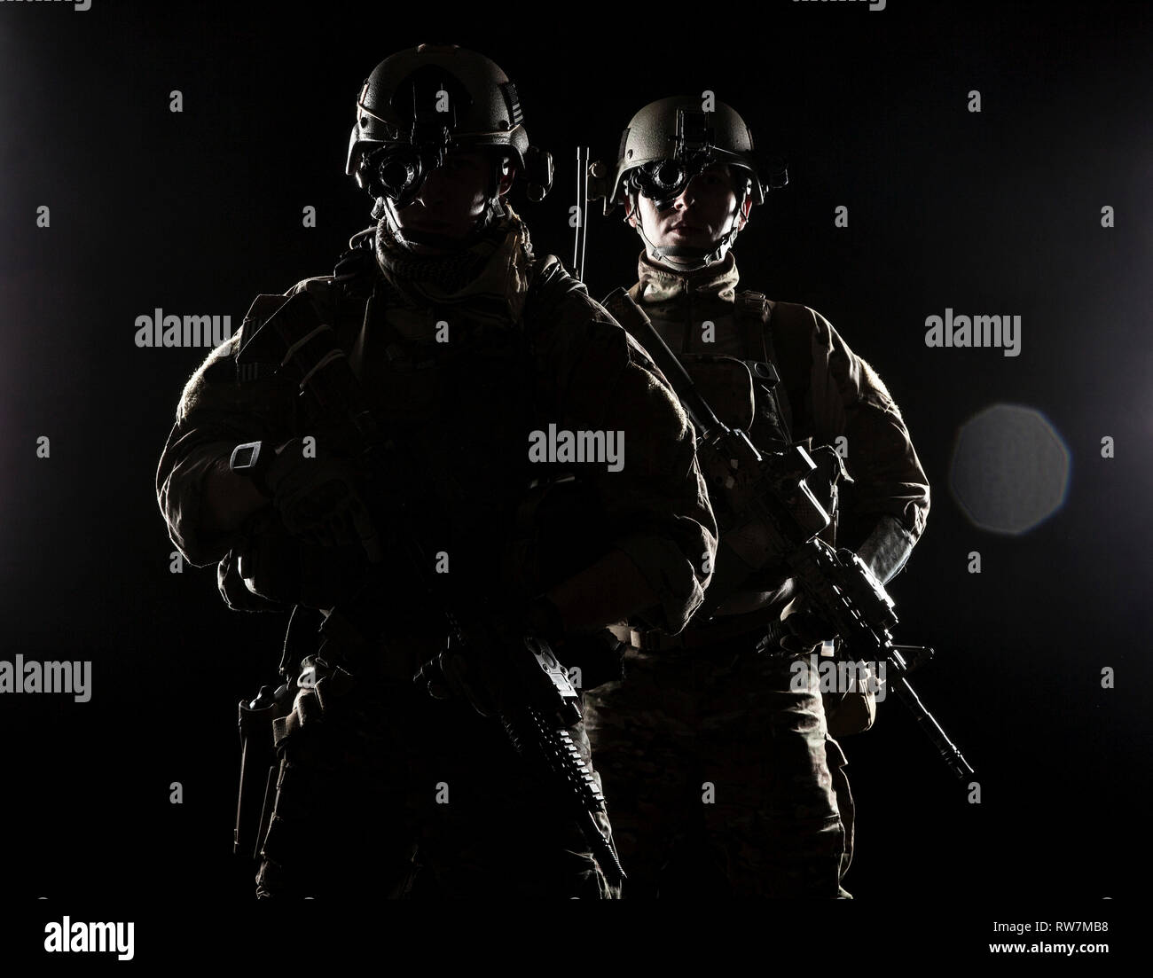 United States Army rangers with assault rifles on dark background Stock ...