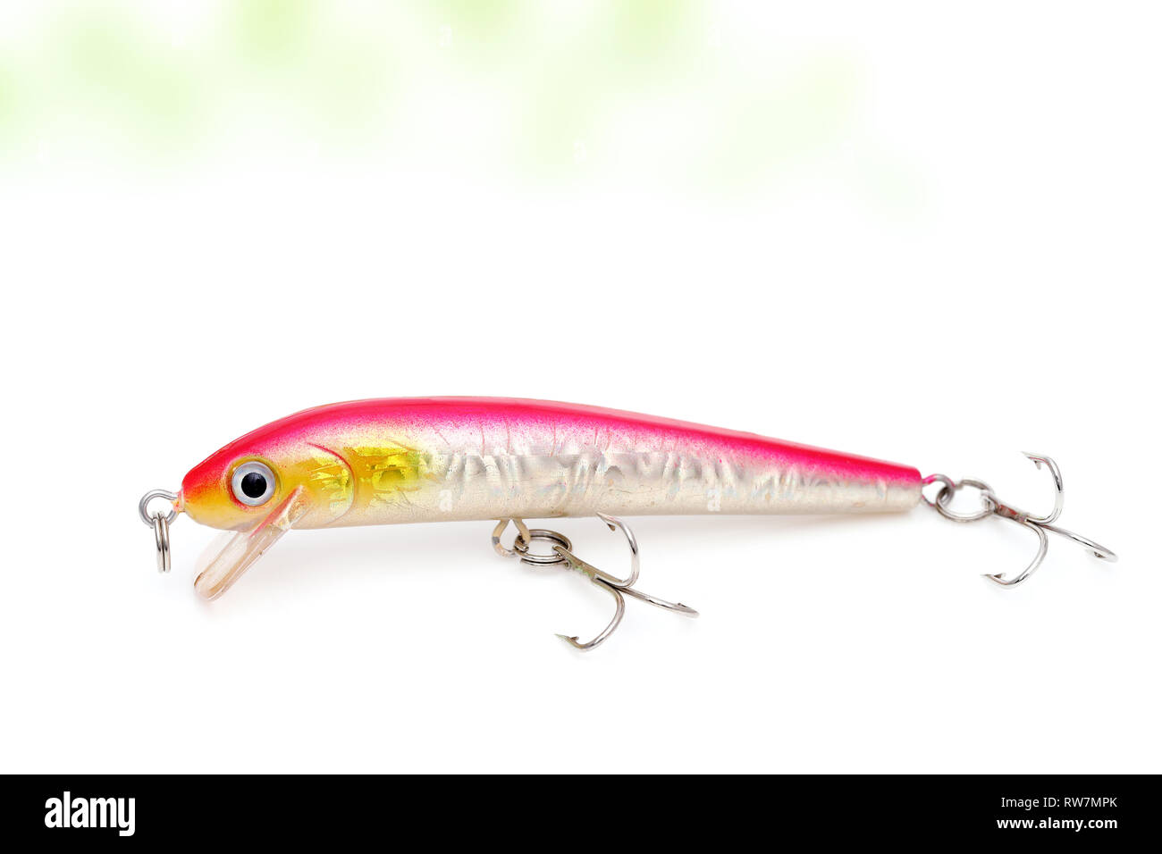 Plastic fishing lure on a white background Stock Photo - Alamy