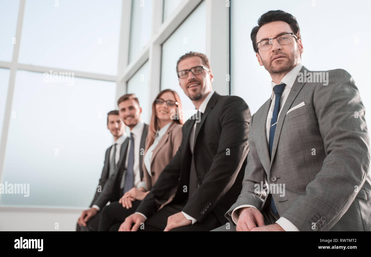 Row of business people waiting for an interview Stock Photo - Alamy