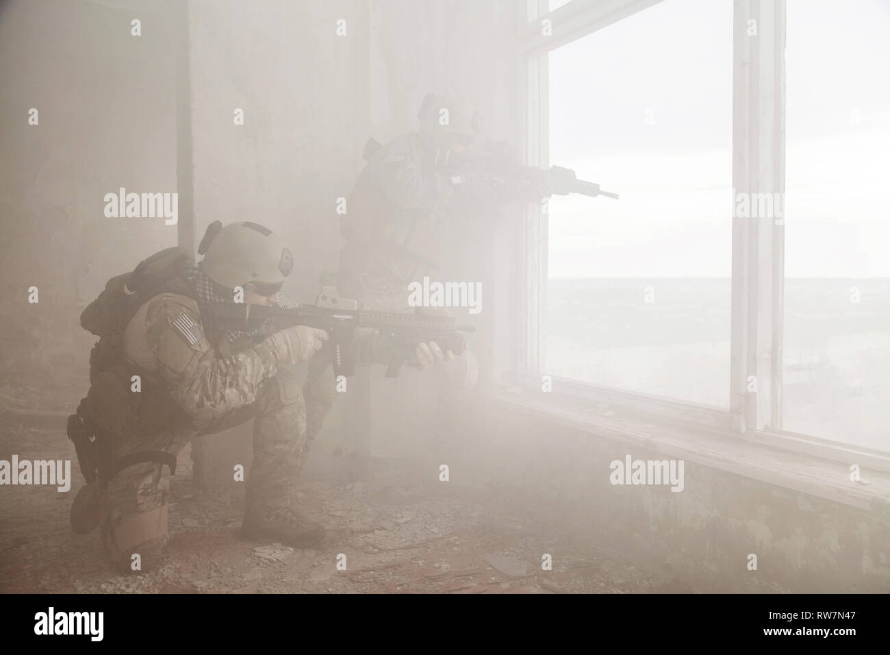 United States Army rangers during a military operation in the smoke and ...
