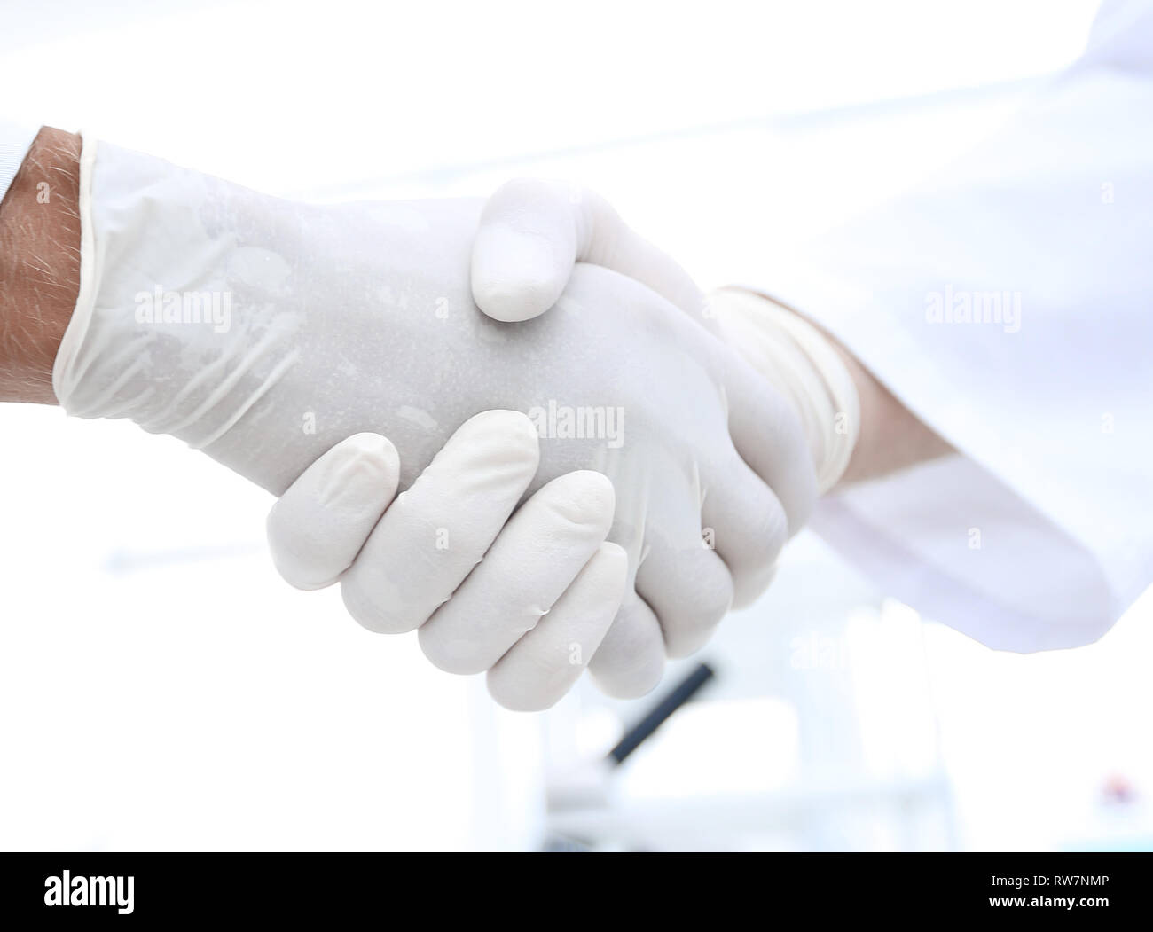 Surgical gloves handshake hi-res stock photography and images - Alamy