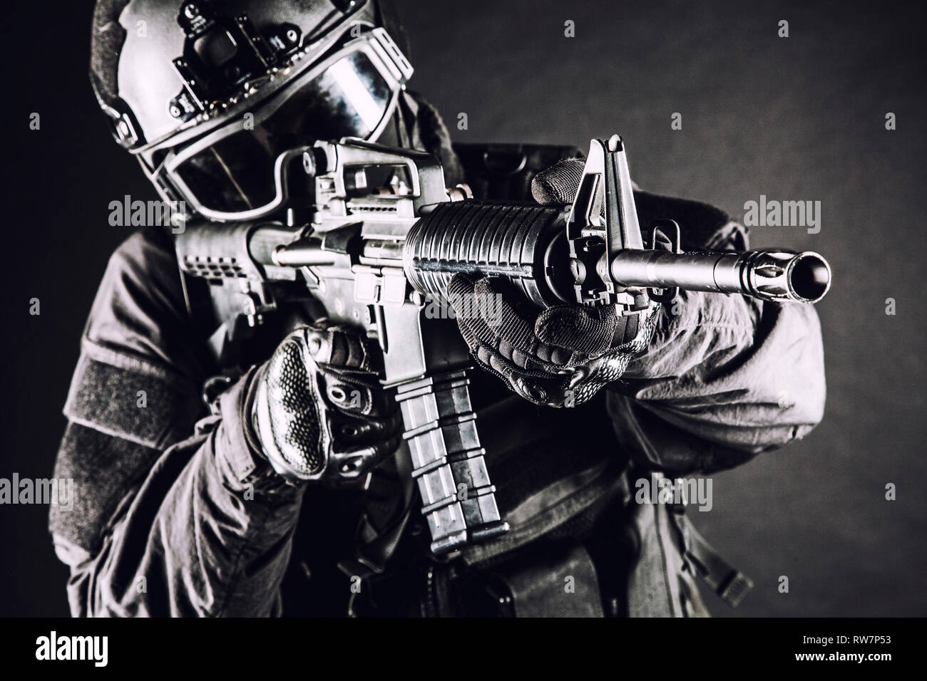 Spec ops police officer SWAT in black uniform and face mask Stock Photo ...