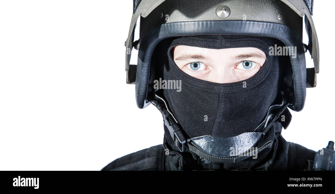 Russian special forces operator in black uniform and bulletproof helmet ...