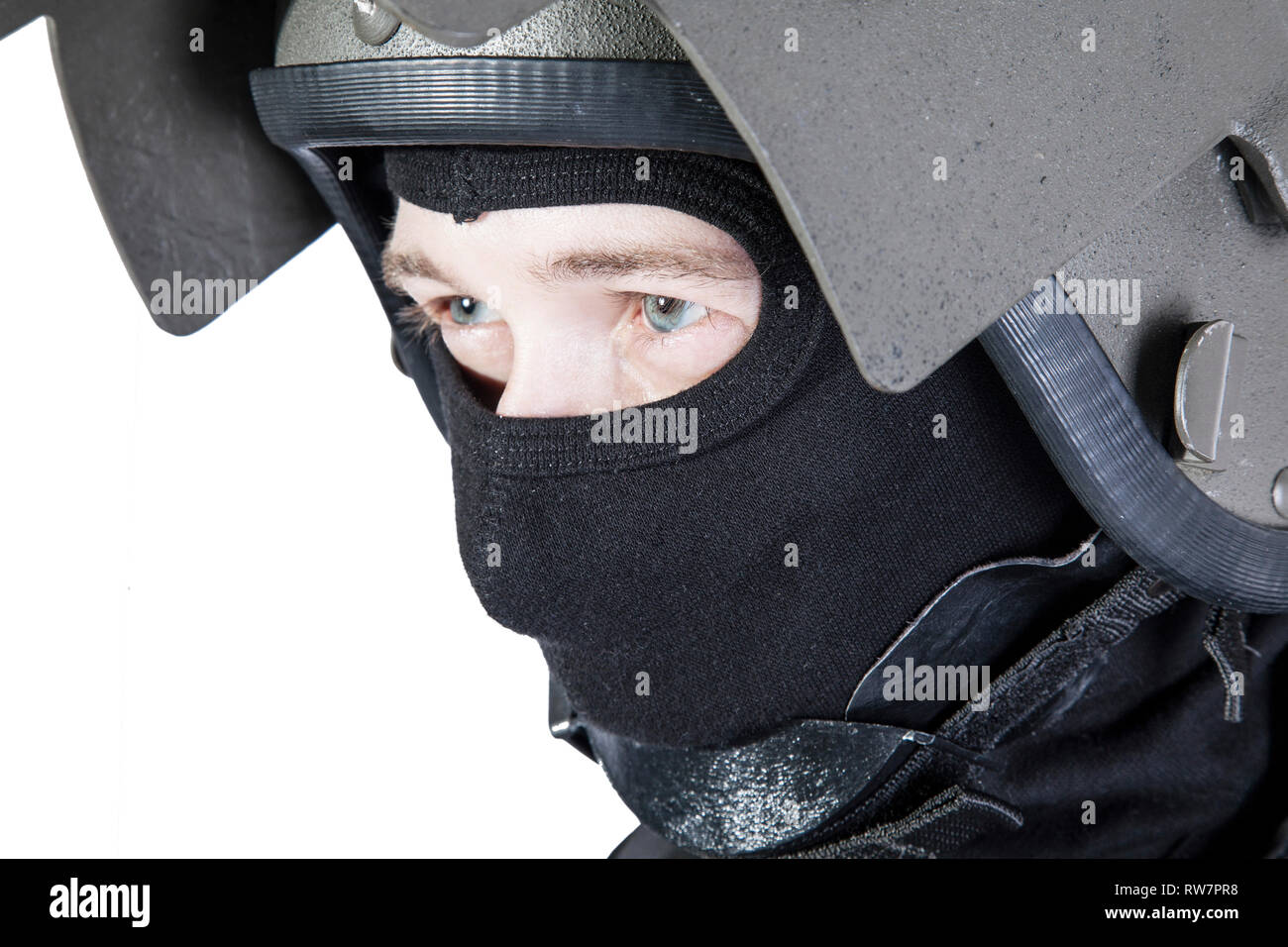 Russian special forces operator in black uniform and bulletproof helmet ...