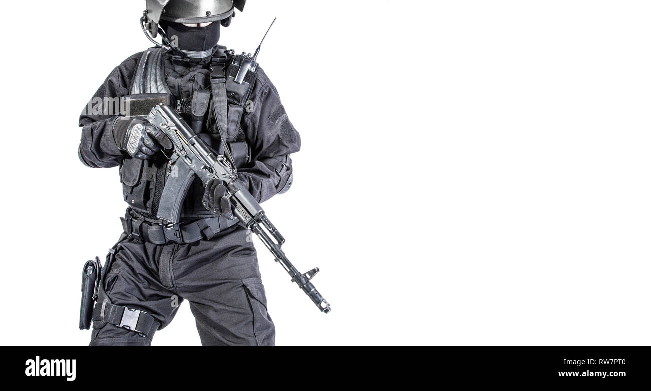 Russian special forces operator in black uniform and bulletproof helmet ...
