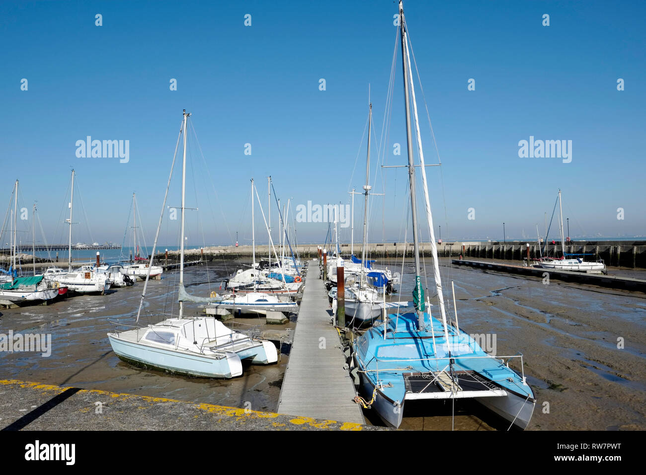 Ryde Harbour on the Isle of Wight at low tide showing yachts and motor ...