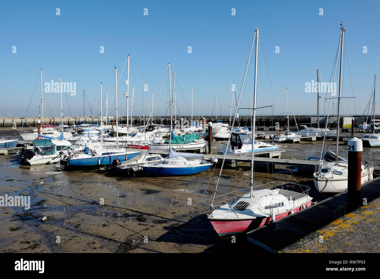 Ryde Harbour on the Isle of Wight at low tide showing yachts and motor ...