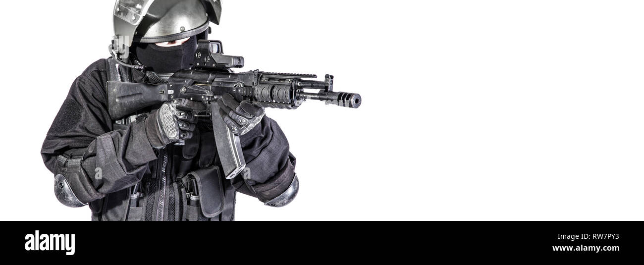 Russian special forces operator in black uniform and bulletproof helmet ...