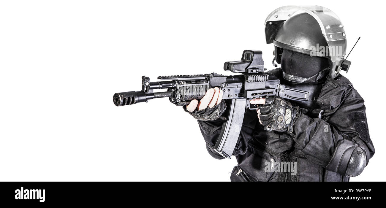 Russian special forces operator in black uniform and bulletproof helmet ...