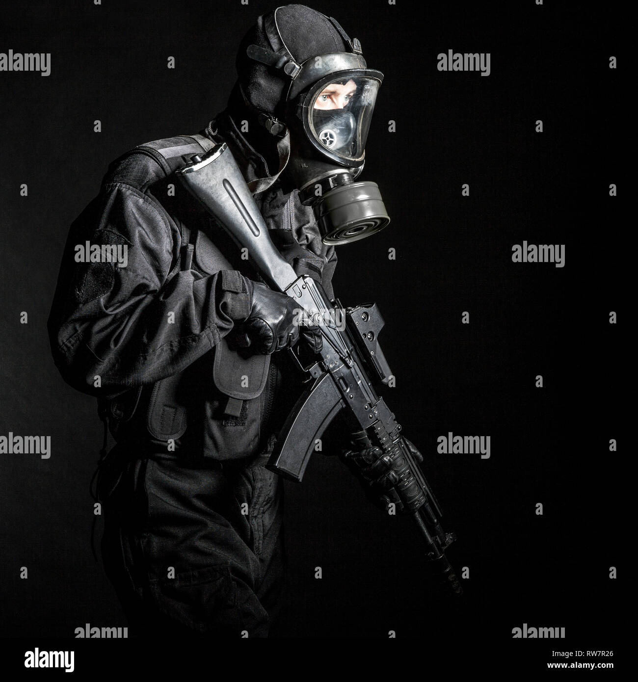 Russian special forces operator in black uniform and gas mask Stock ...