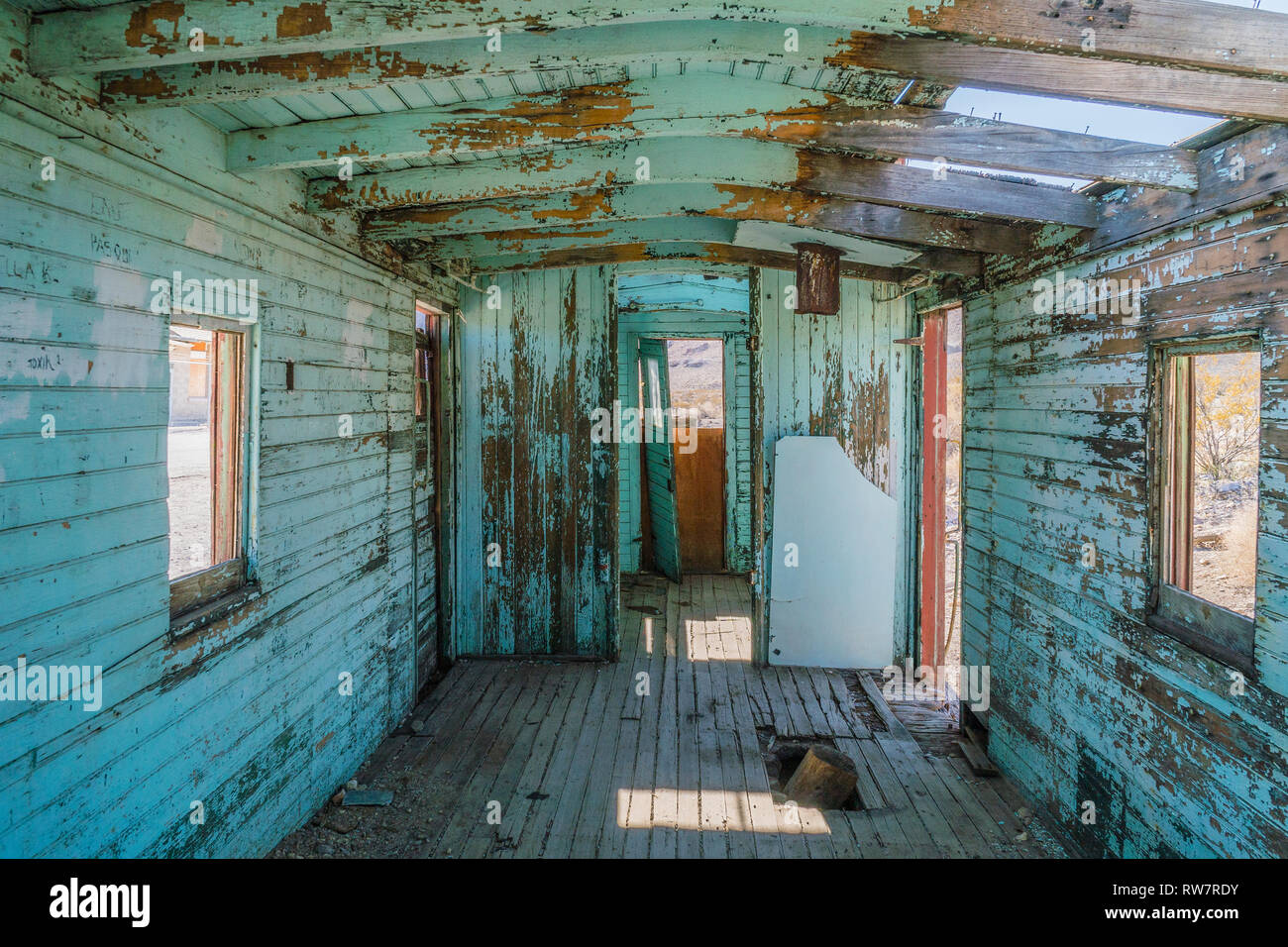 The interior of a neglected Union Pacific caboose train car on a track ...