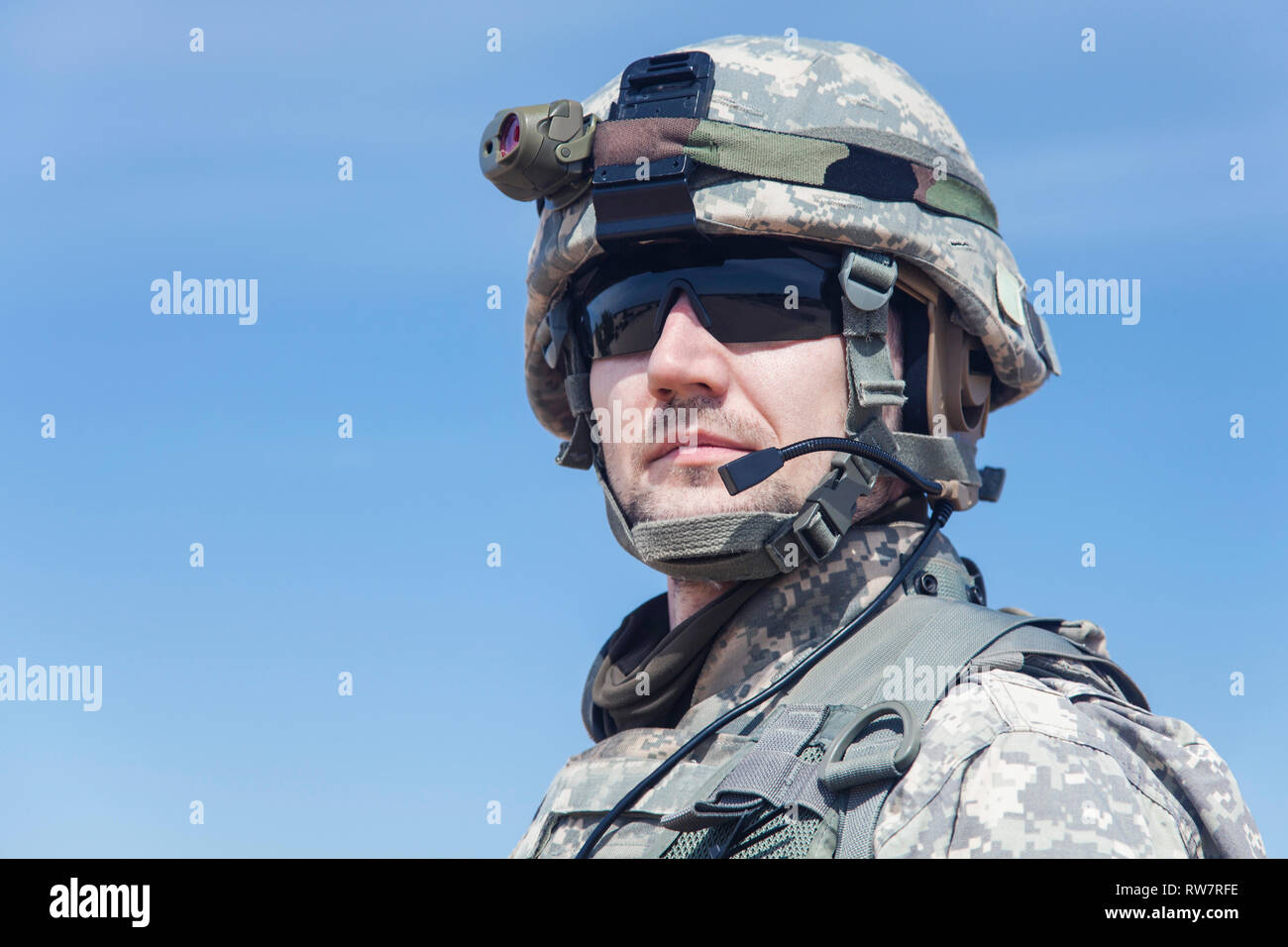 Portrait of United States airborne infantry man with radio microphone ...