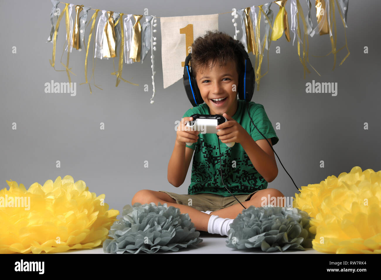 Excited little boy playing video game Stock Photo - Alamy
