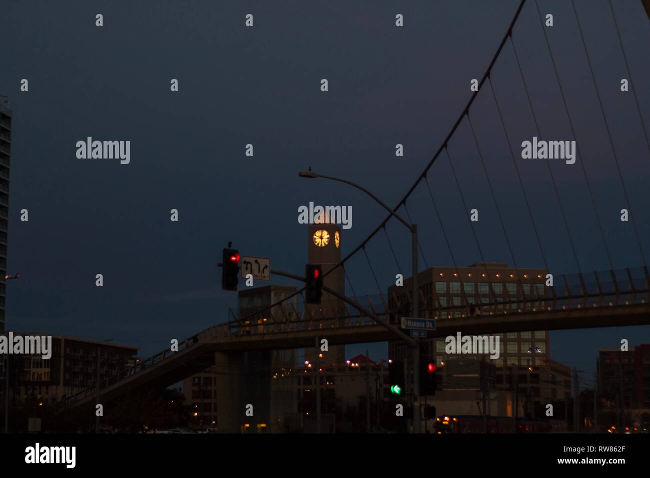 Tall clock tower in the center framed with other architectural designs ...