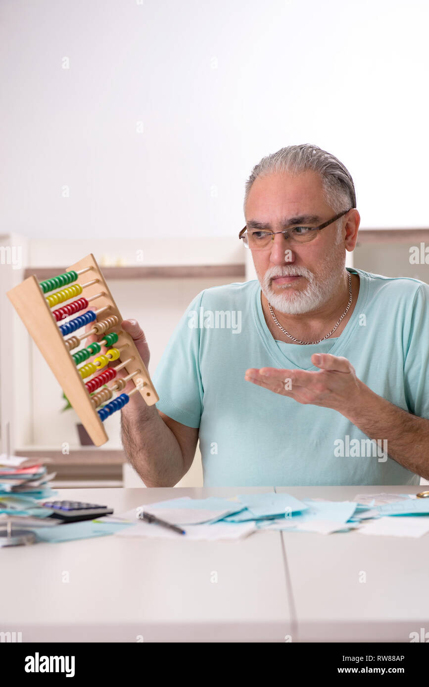 White bearded old man in budget planning concept Stock Photo - Alamy