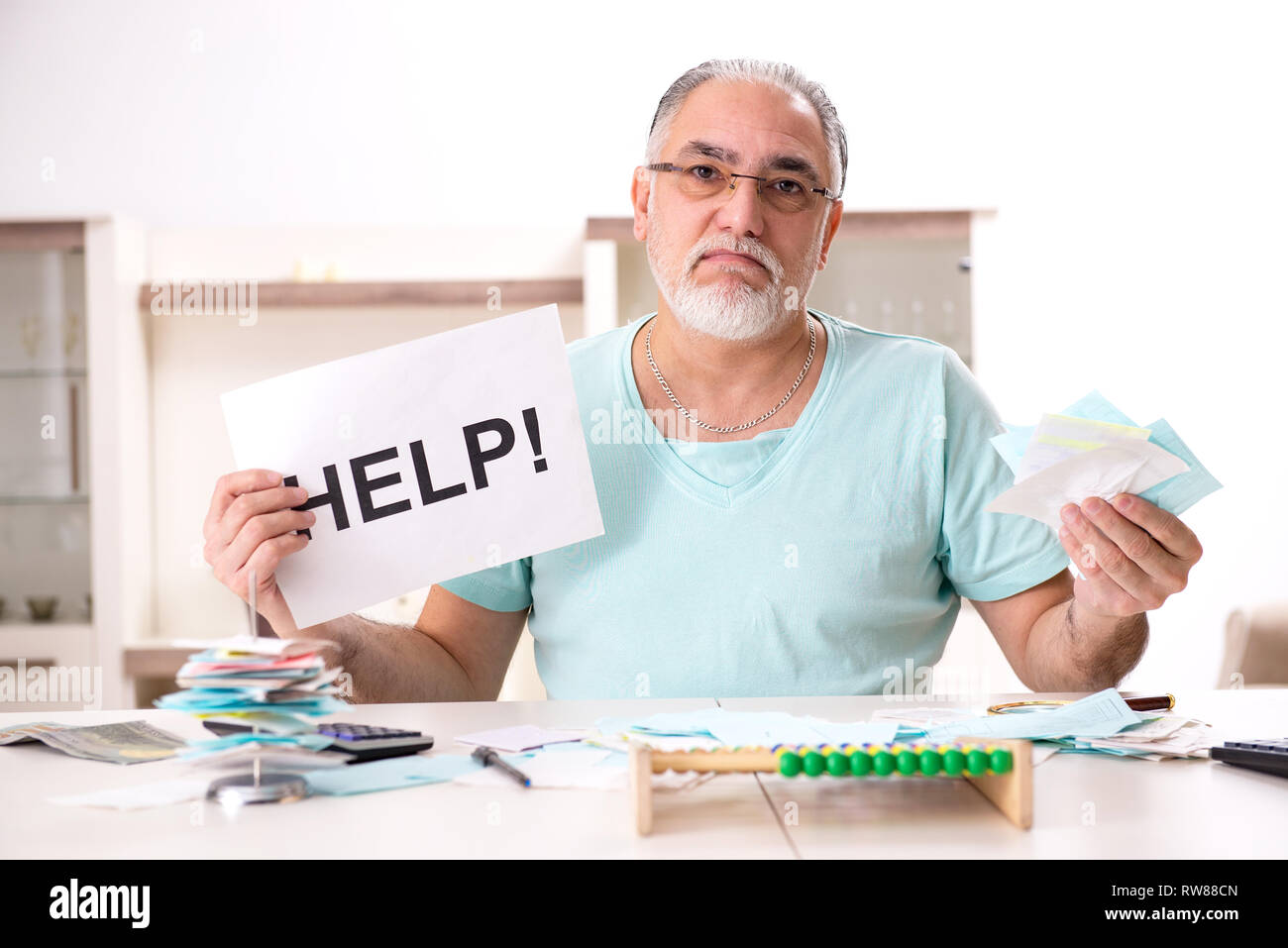 White bearded old man in budget planning concept Stock Photo - Alamy