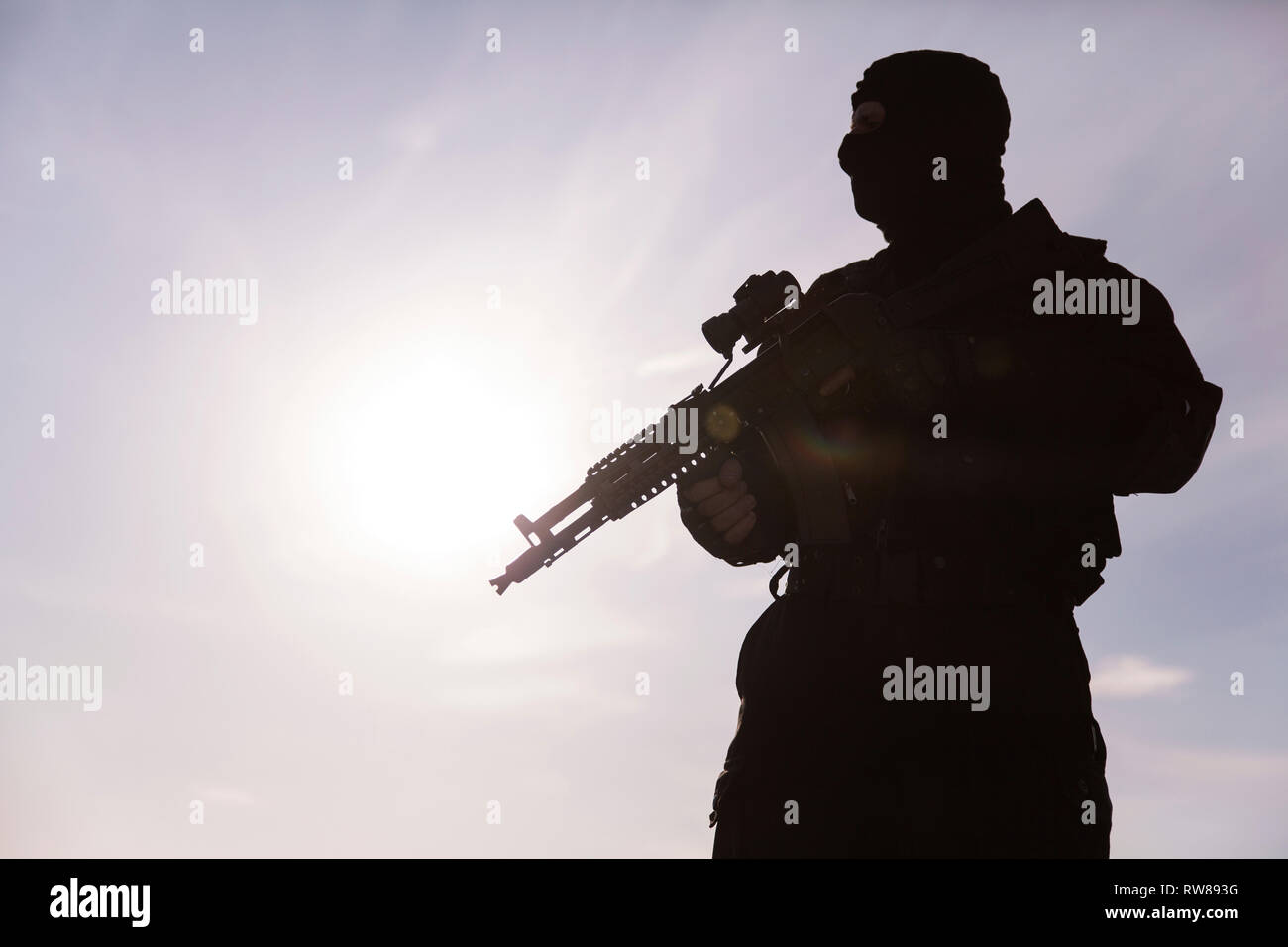 Silhouette of special forces operators with weapon Stock Photo - Alamy