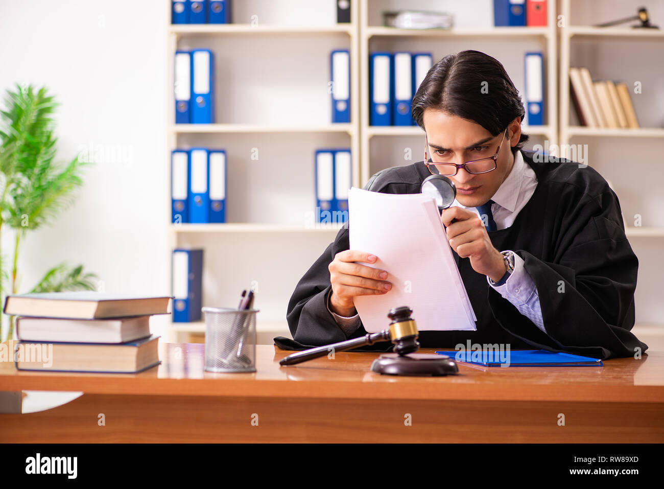 Young handsome judge working in court Stock Photo - Alamy