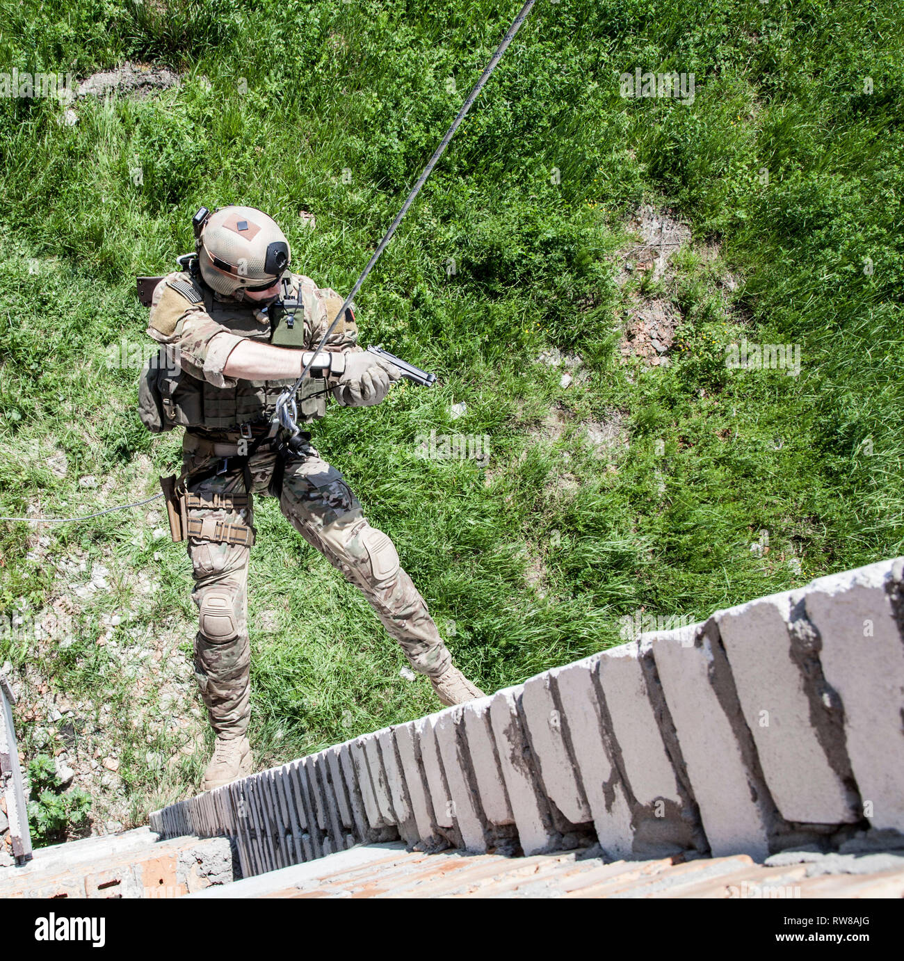 Soldier during assault rappelling exercises with weapons Stock Photo ...