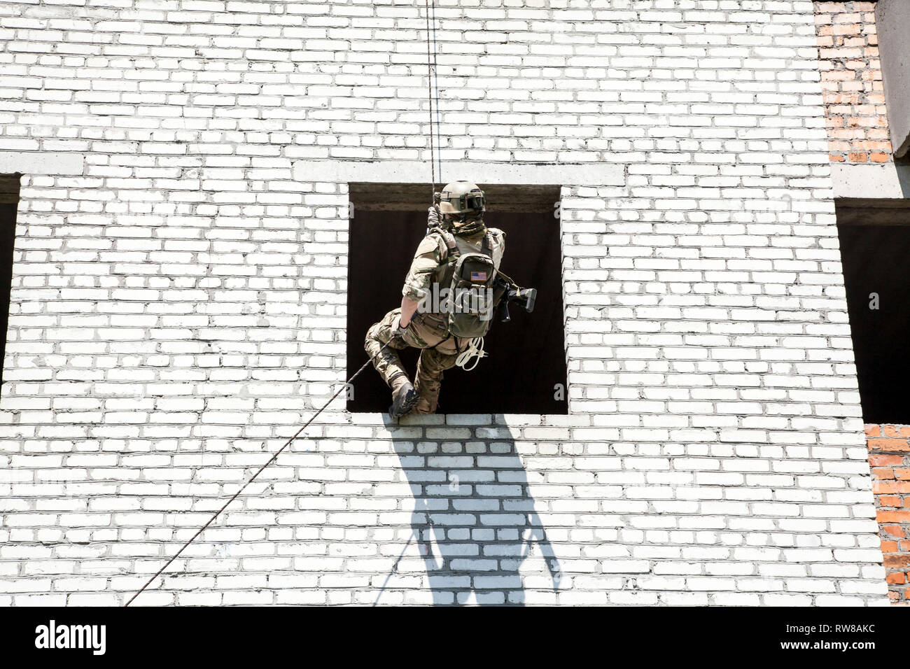 Soldier during assault rappelling exercises with weapons Stock Photo ...