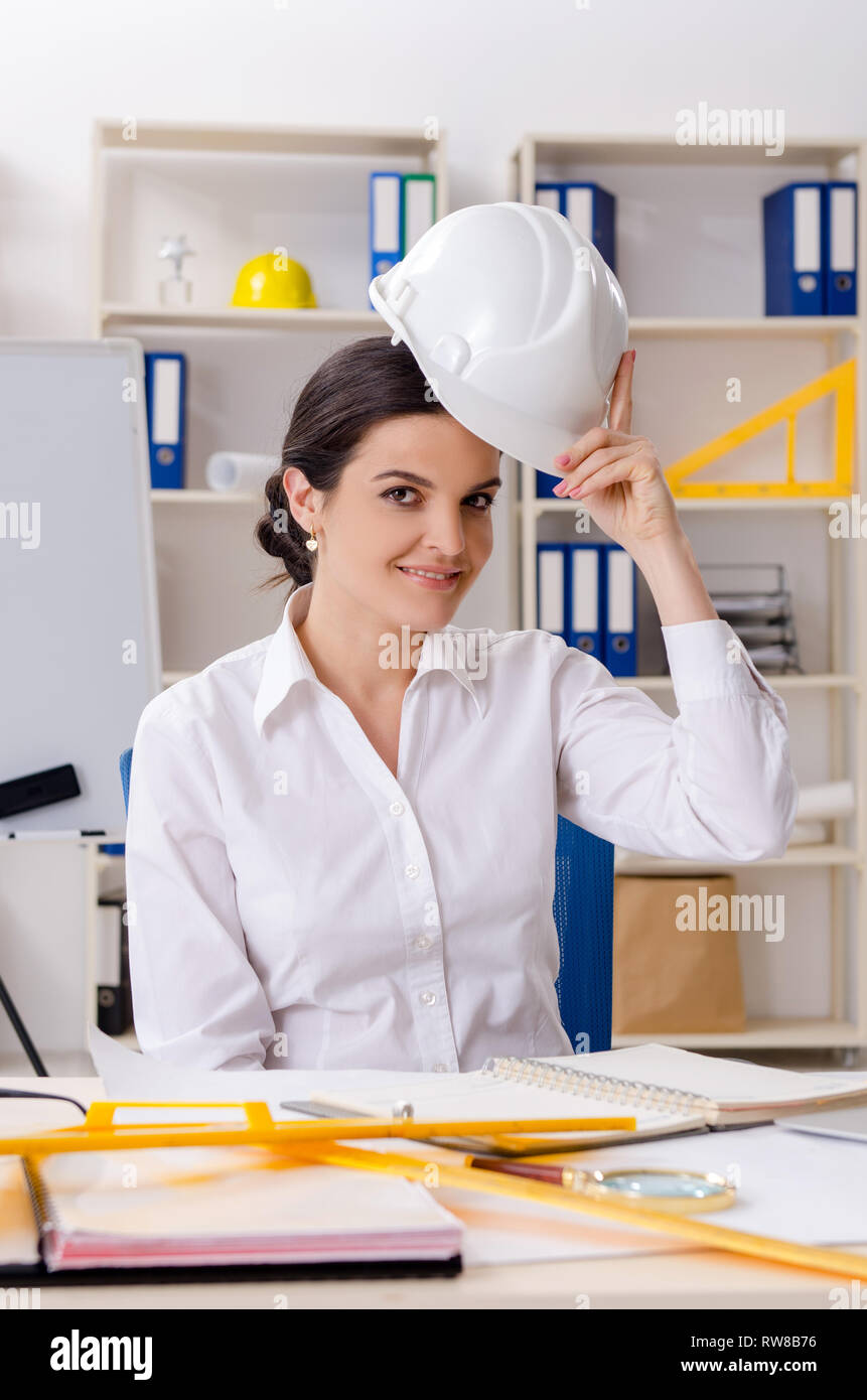Female architect working in the office Stock Photo - Alamy