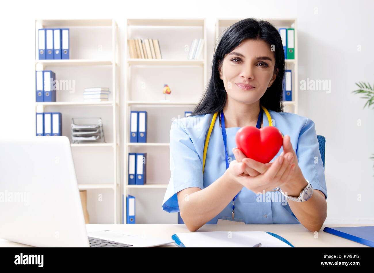 Female doctor cardiologist working in the clinic Stock Photo - Alamy