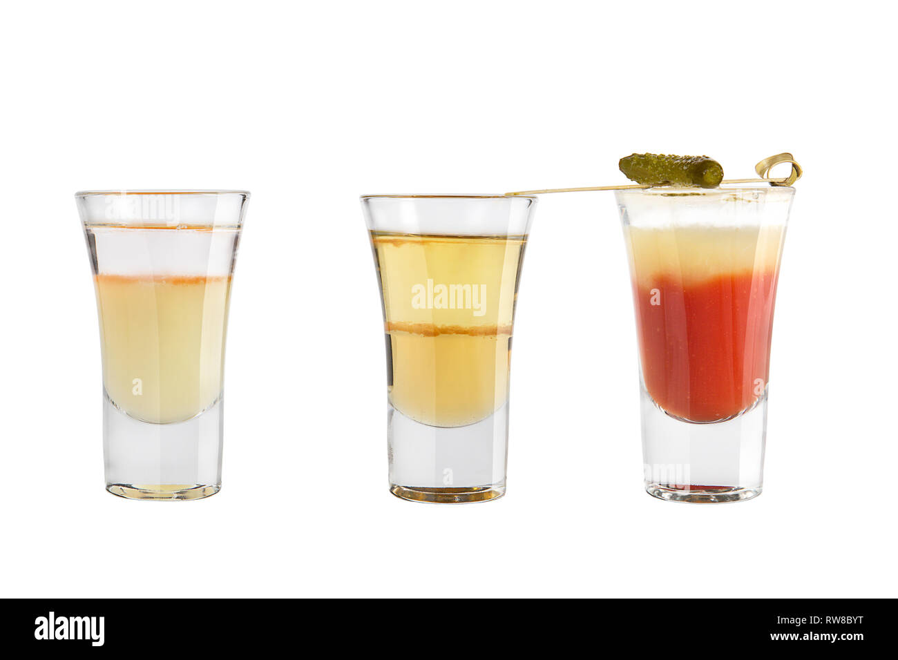 Set of alcohol shots on a white background. Three shots different with ...