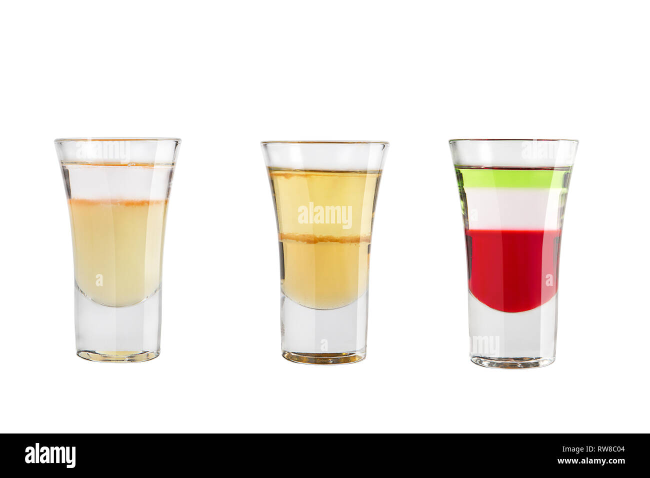Set of alcohol shots on a white background. Three shots of interesting ...