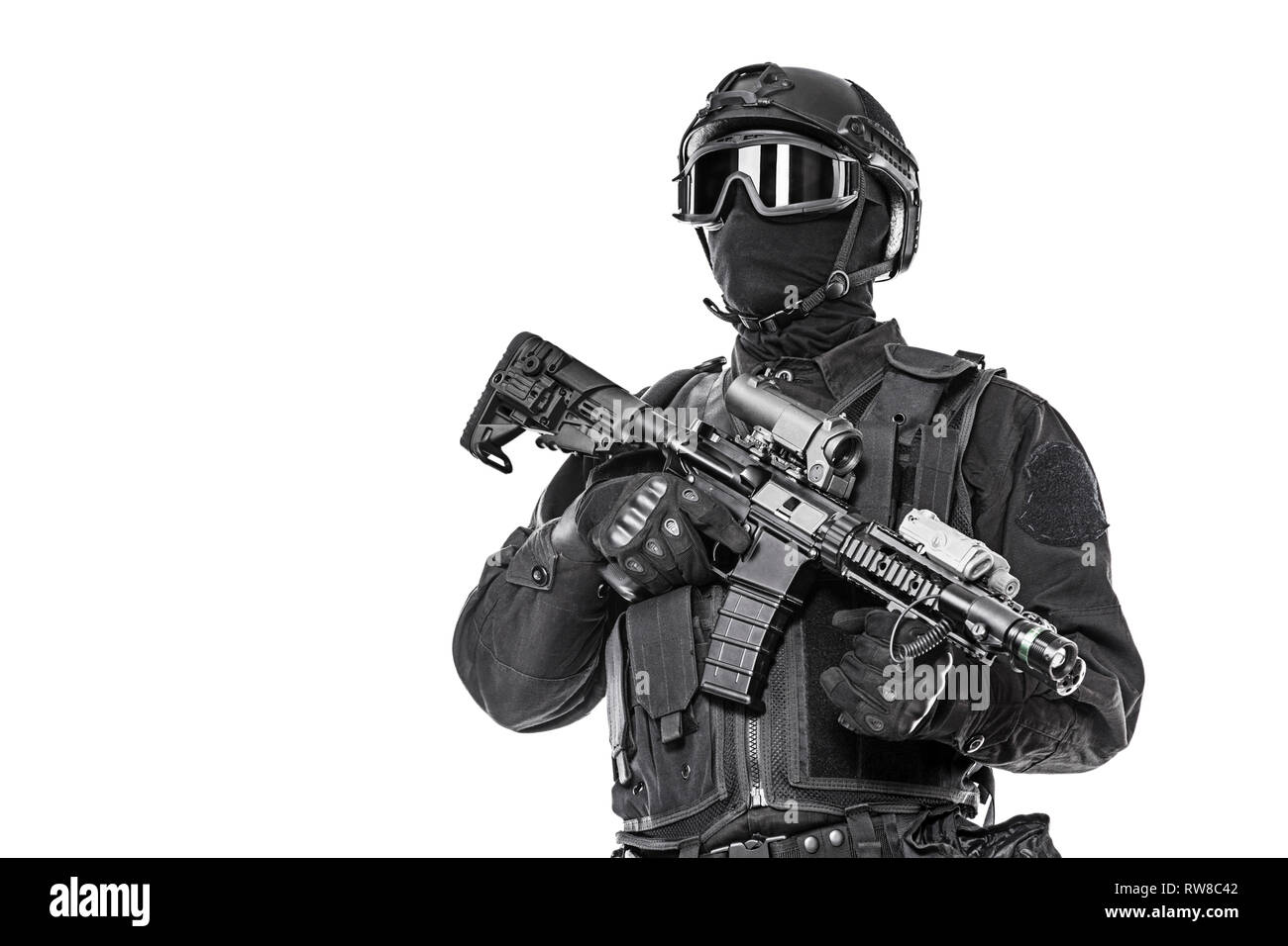Studio shot of SWAT operator with assault rifle Stock Photo - Alamy