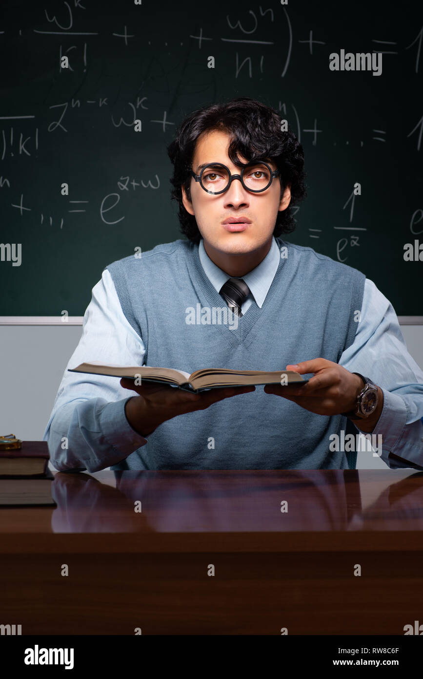 Man in front of blackboard math hi-res stock photography and images - Alamy