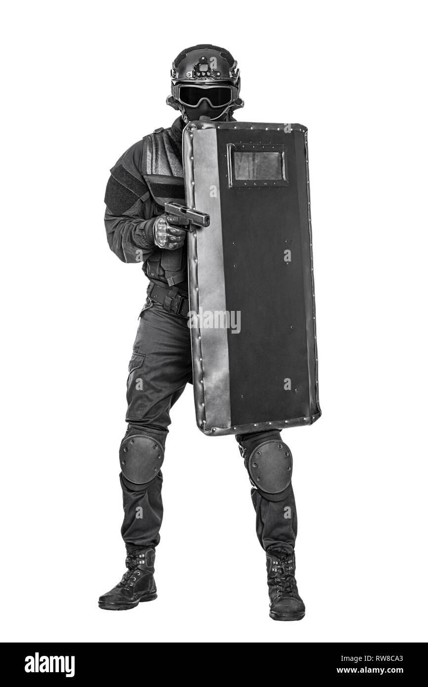 Studio shot of SWAT police special forces standing behind ballistic ...