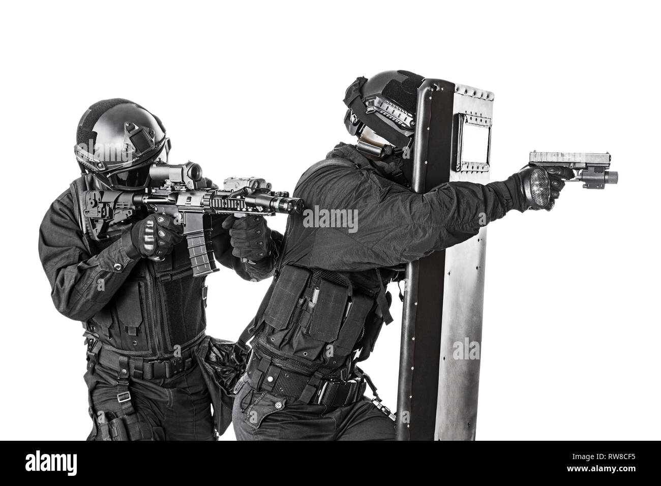Studio shot of SWAT police special forces hiding behind ballistic ...