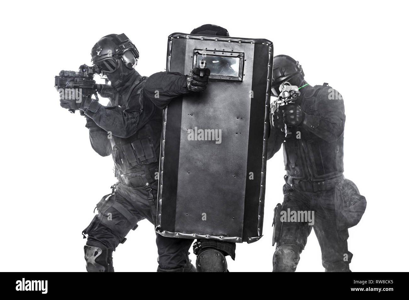 Studio shot of SWAT police special forces hiding behind ballistic ...