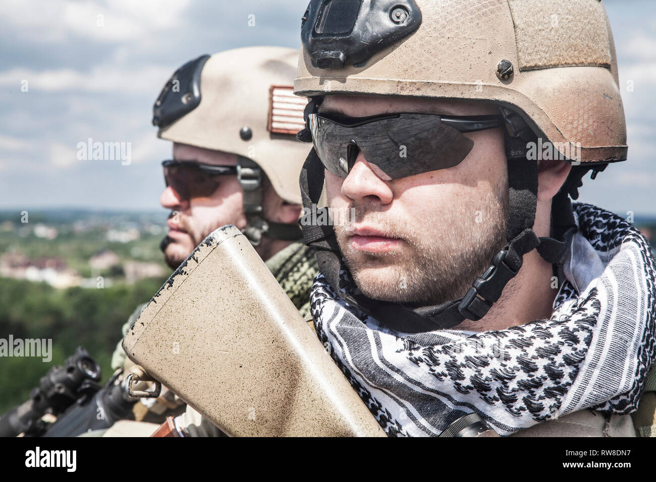 Navy SEALs Team with weapons in action Stock Photo - Alamy
