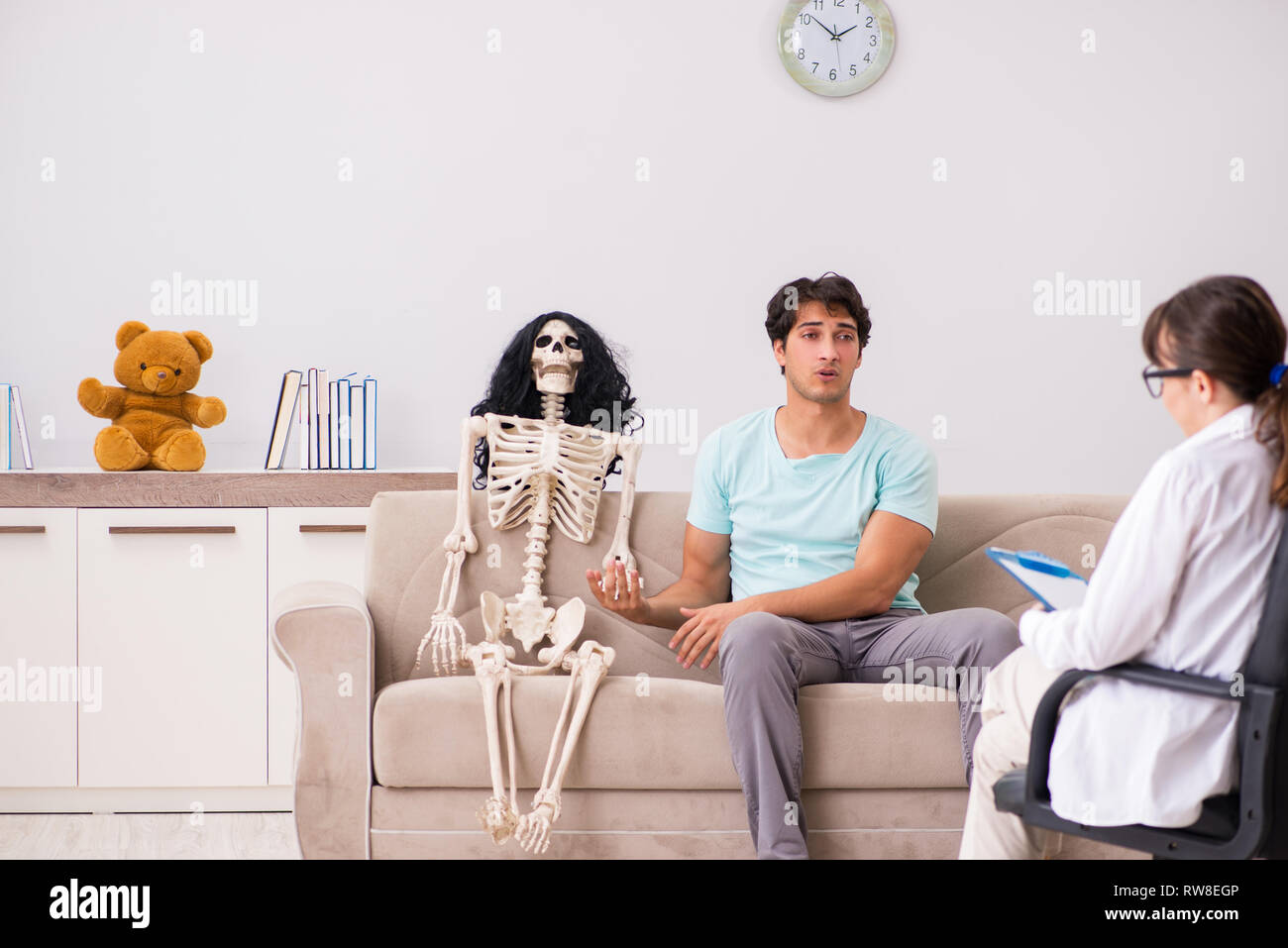 Young patient visiting psychologist for therapy Stock Photo - Alamy