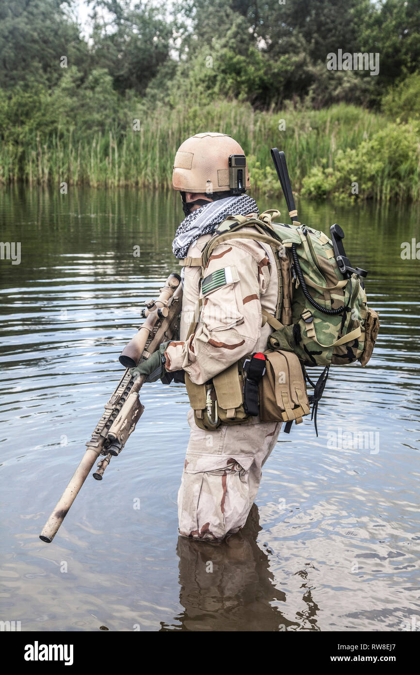 Member of Navy SEAL Team crossing the river with weapons Stock Photo ...