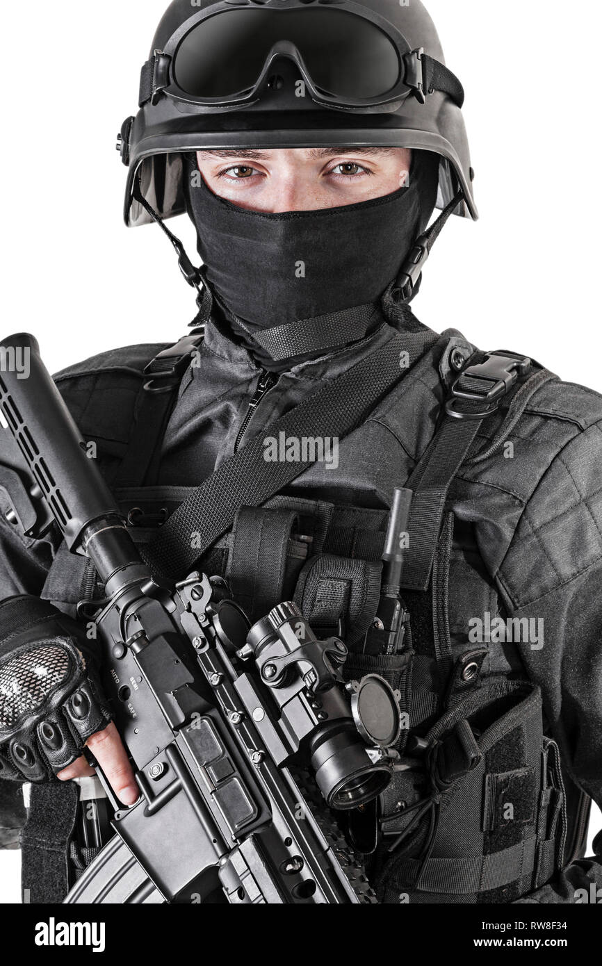 Spec ops police officer SWAT in black uniform, studio shot Stock Photo ...