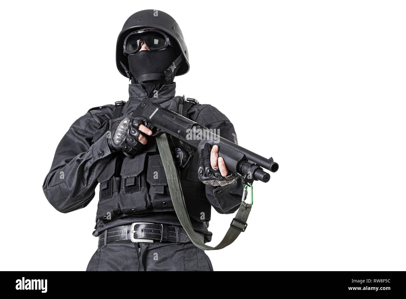 Spec ops police officer SWAT in black uniform with shotgun, studio shot ...