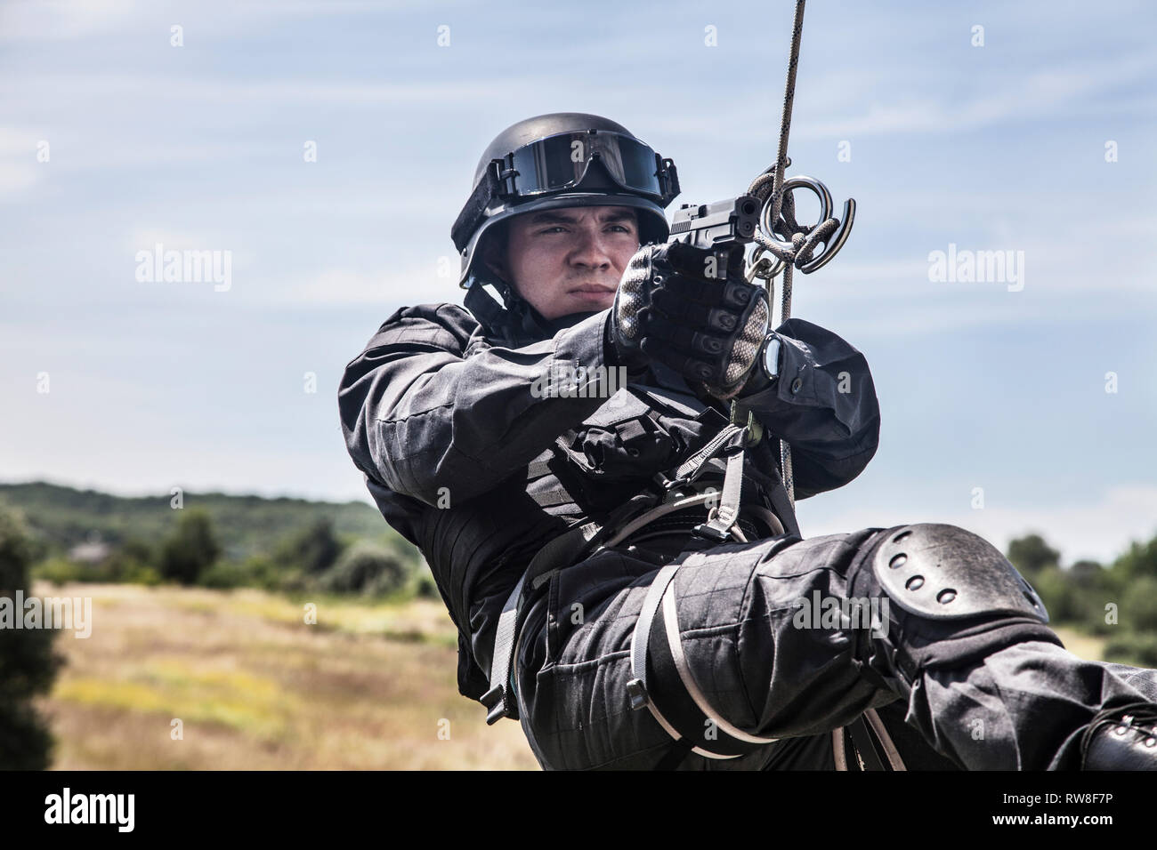 Spec ops police officer SWAT during assault operation Stock Photo - Alamy