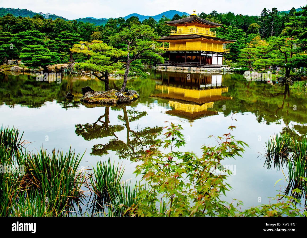 Golden Pavilion Temple and Gardens at Kyoto in Japan reflected in ...