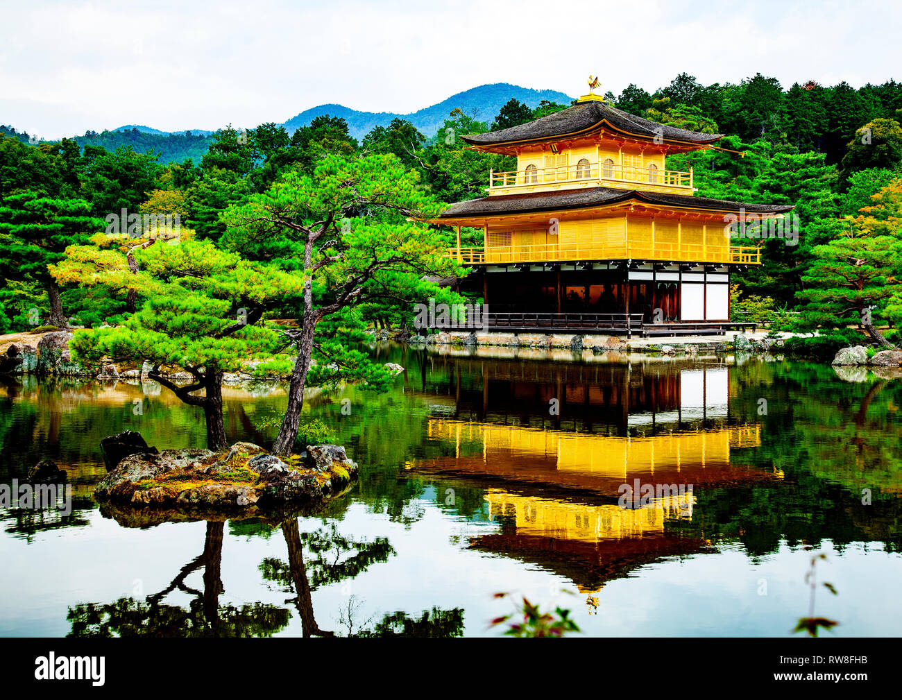 Golden Pavilion Temple and Gardens at Kyoto in Japan reflected in ...