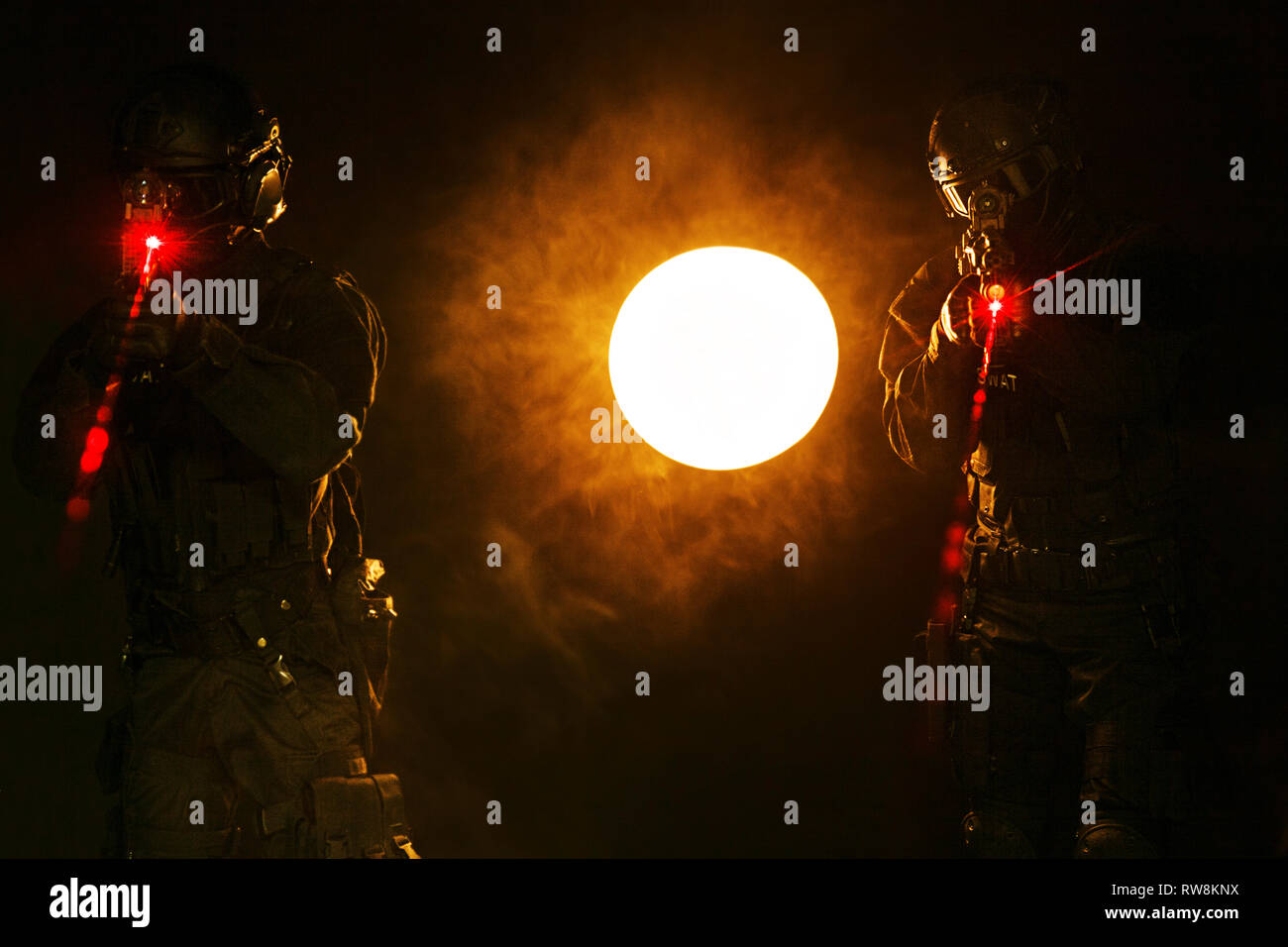 Police officers SWAT wearing black uniform in the smoke with laser ...