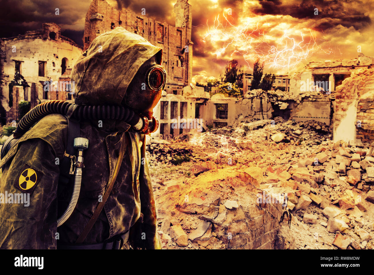Post apocalypse survivor in tatters and gas mask on the ruins of a ...