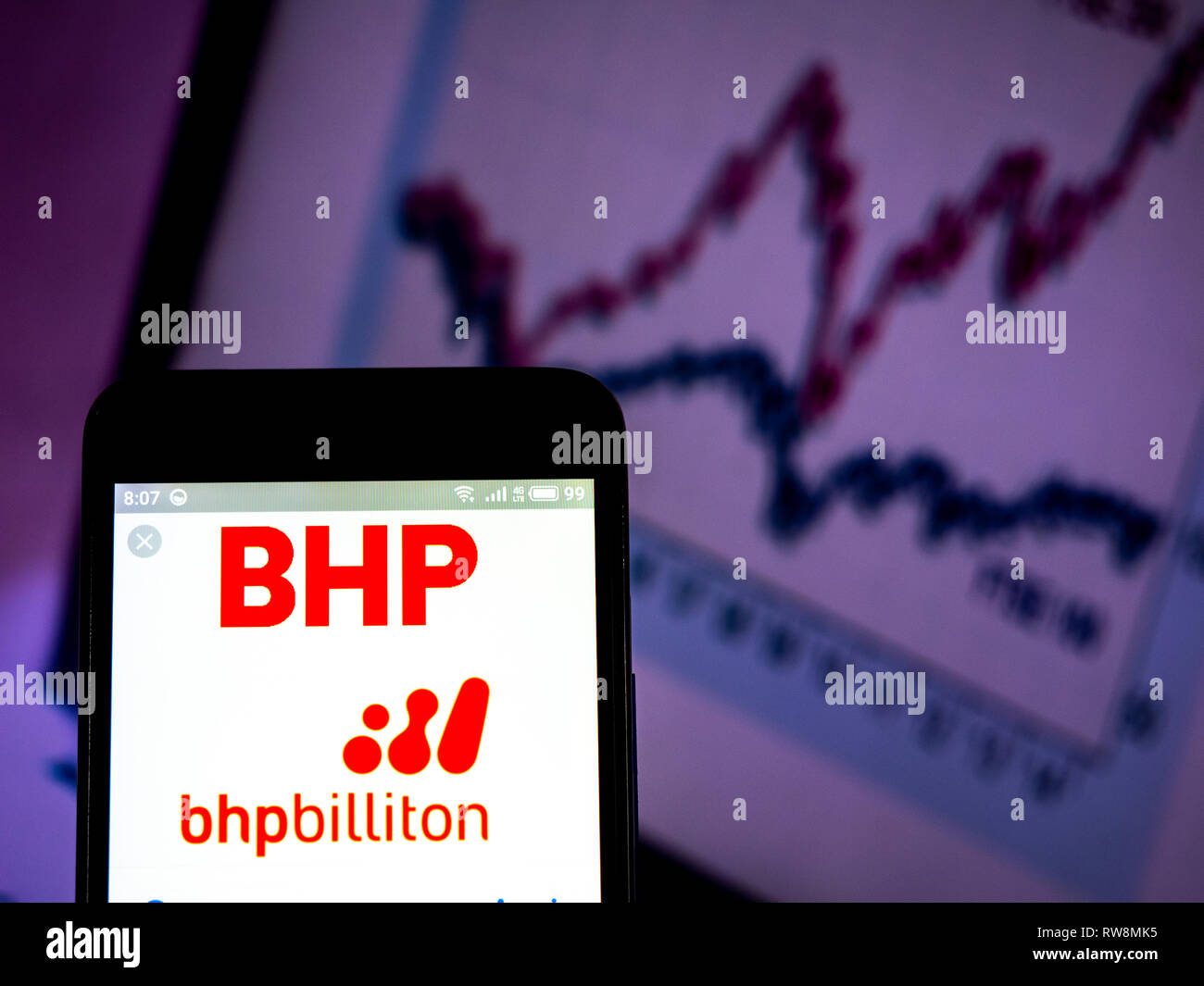 BHP Billiton mining company logo seen displayed on smart phone. This ...