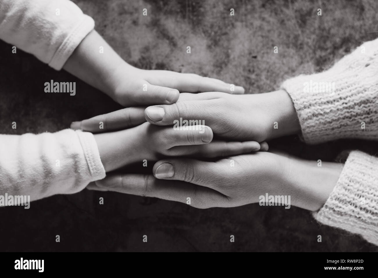 Close up view of family holding hands, loving caring mother supporting ...
