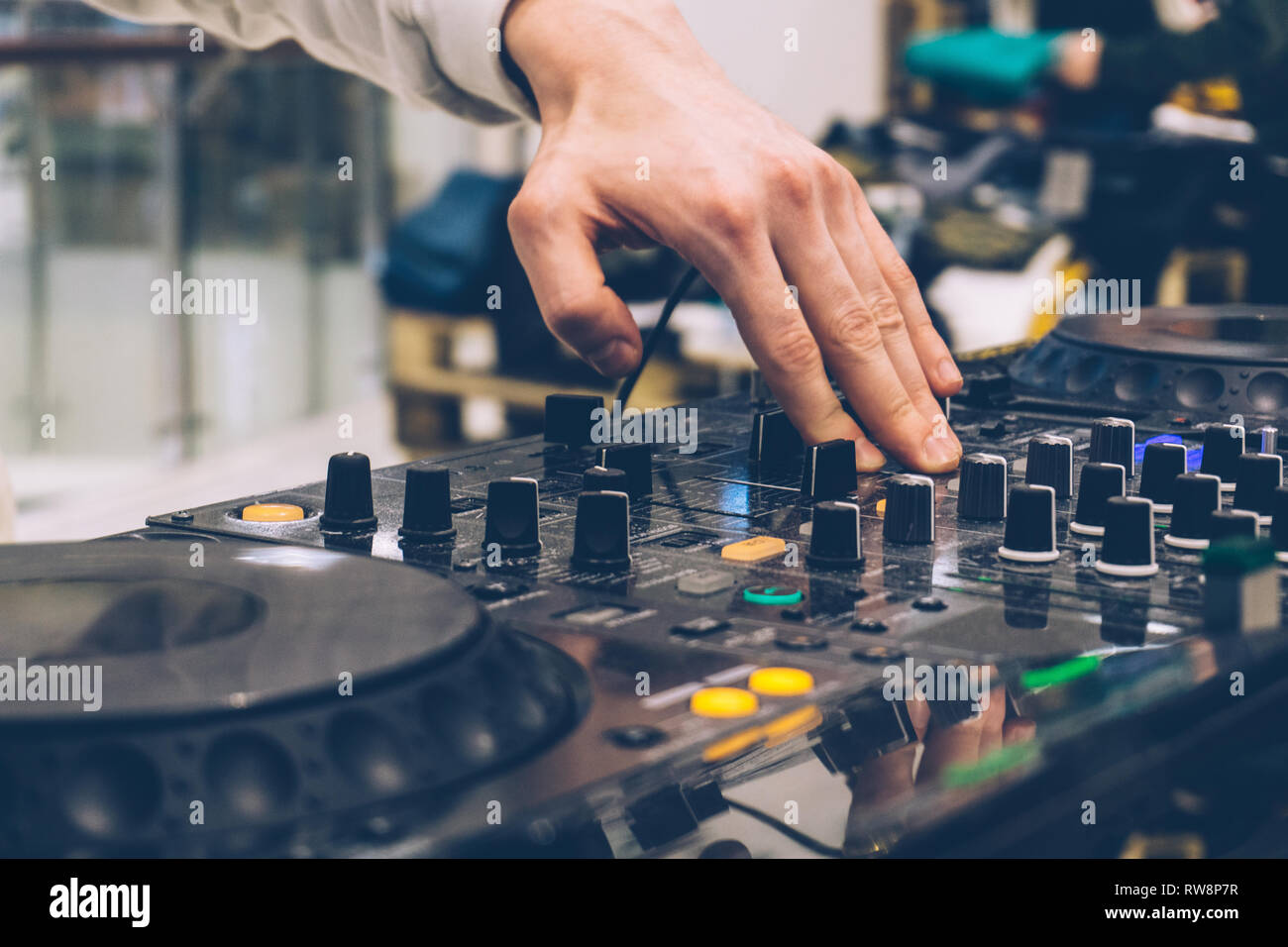 DJ console on the performance (party). Creating music and tuning DJ on ...