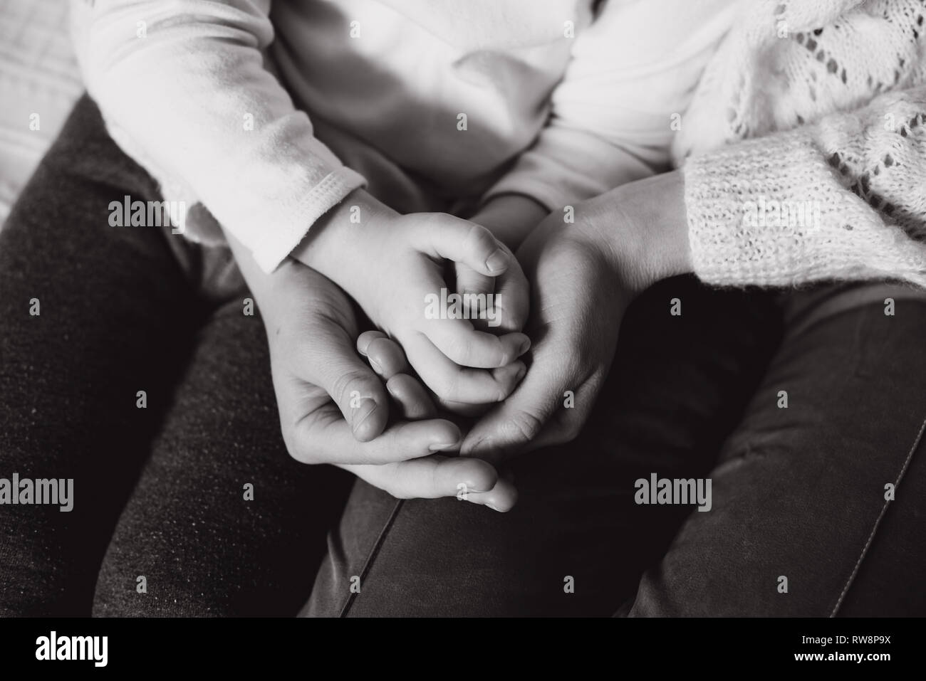 Close up view of family holding hands, loving caring mother supporting ...