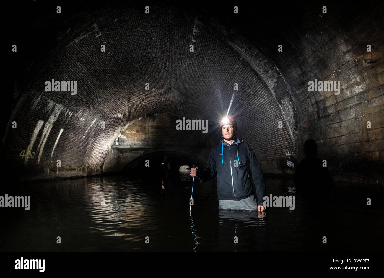 A man urban caving as an underground network of rivers are opened up to ...