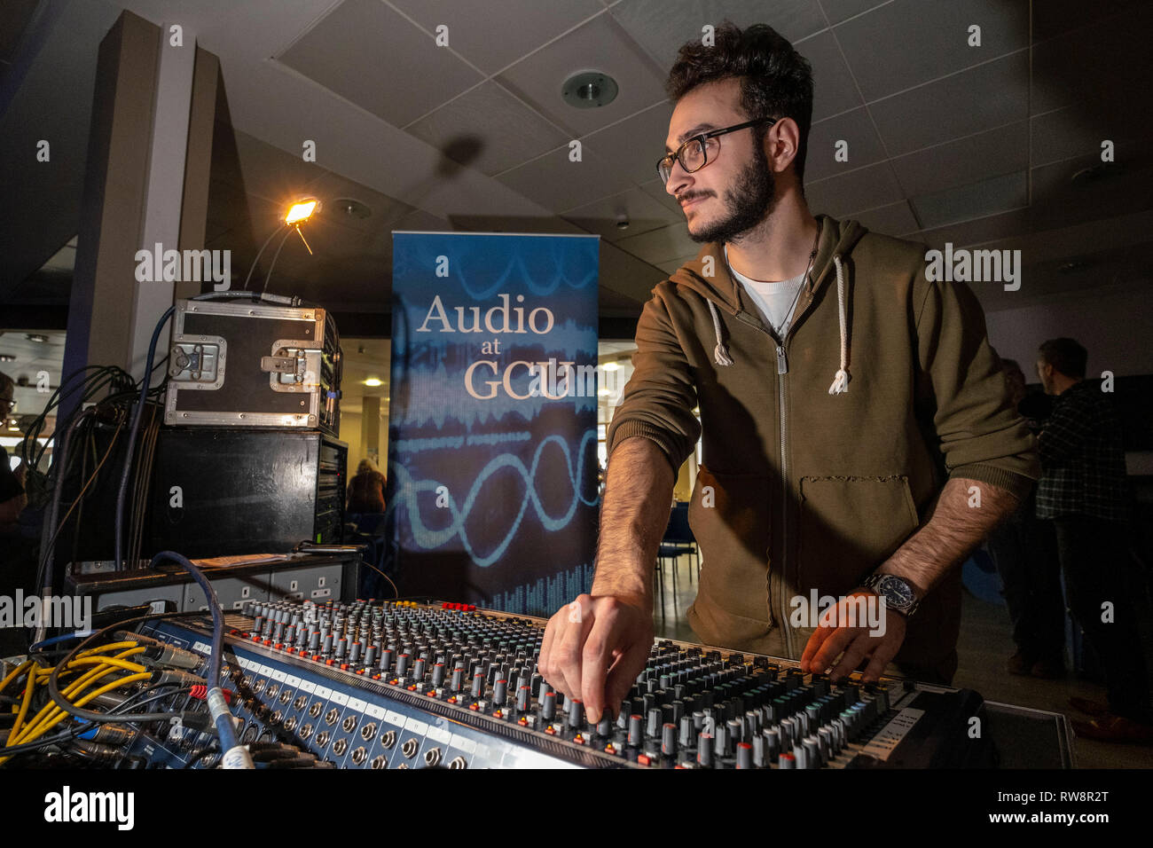 Sound Engineers working at mixing desk Stock Photo - Alamy